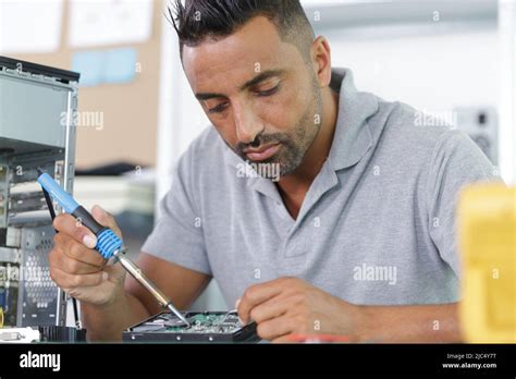 Man Soldering A Circuit Board Stock Photo Alamy
