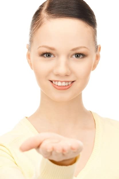 Premium Photo Beautiful Woman Showing Something On The Palm Of Her Hand