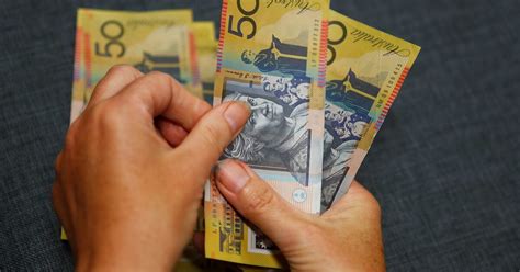 Australia S Central Bank Says Closer To Normalising Rates Hints At Range Reuters