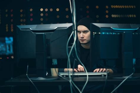 Premium Photo Hacker In Headset And Eyeglasses With Keyboard Hacking Computer System Or