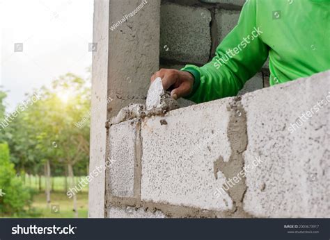 Worker With Concrete Block Cement Over Royalty Free Licensable Stock Photos Shutterstock