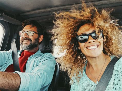 Happy Young Couple Traveling By Car Together Having Fun Woman Taking