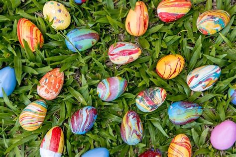 Premium Photo Colored Easter Eggs On The Grass