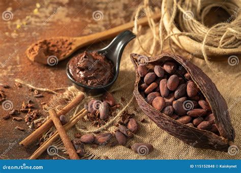 cocoa pod beans and cocoa nibs setup on rustic wooden background stock