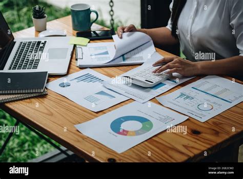 Close Up Woman Calculating Using Machine Managing Household Finances At Home Focused Biracial