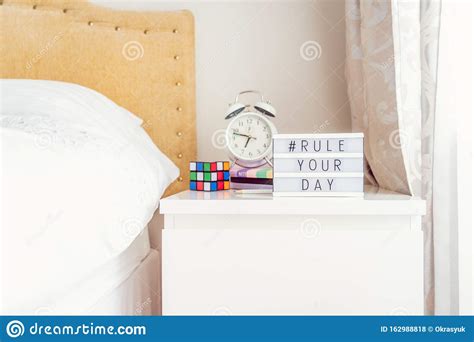 inspiration motivational life quotes hashtag rule your day message on lightened box with alarm