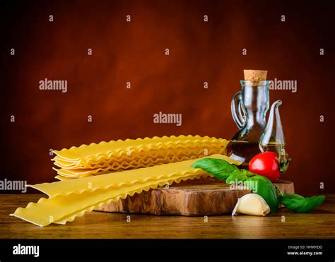 Yellow Reginette Pasta With Olive Oil Basil And Tomato Italian Cuisine Lasagna And Seasoning