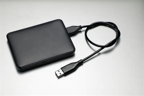 Premium Photo External Hard Drive For Backup On Gray Background