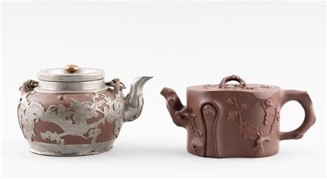 Lot Two Red Clay Yi Xing Pottery Teapots One Mounted In Pewter With Dragons Tallest 4 1 2 In