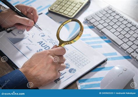 Man Holding Magnifying Glass With A Graphs And Charts Business Stock Image Image Of
