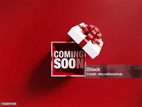 Coming Soon Word Is Coming Out Of A White T Box Tied With Red Ribbon