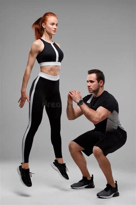 Sporty Couple Showing Muscle And Workout In Gym Muscular Man And Wowan