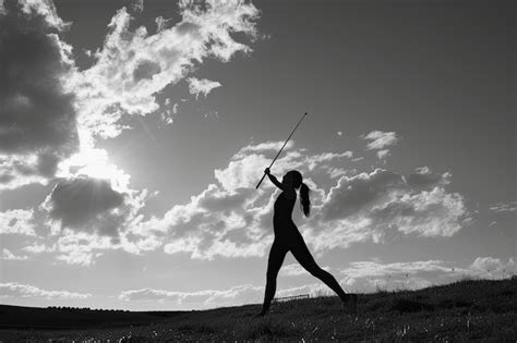 Premium Photo A Female Athlete Practicing Her Javelin Throw Technique In An Open Field