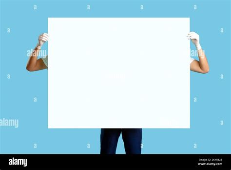Labourer In Protective Gloves Hiding Behind Big Empty Sheet Poster