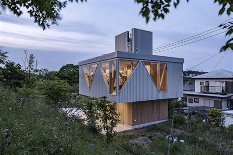 Angular Apertures Cut Through Wooden Residence In Japan