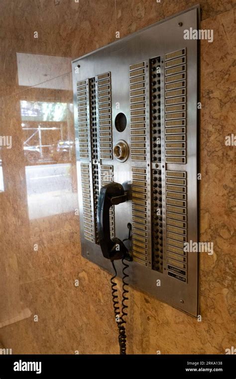 An Outdated And Unused Lobby Intercom System With Corded Phone In A Co