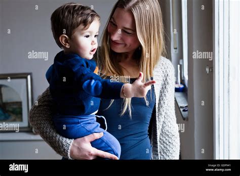 Woman Carrying Baby Hi Res Stock Photography And Images Alamy