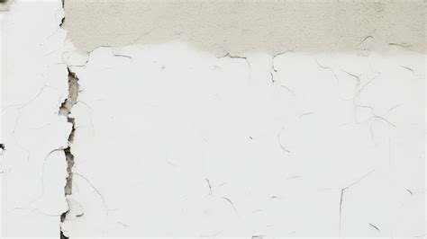 오래된 금이 간 페인트 배경이 있는 콘크리트 벽의 파노라마 프리미엄 사진