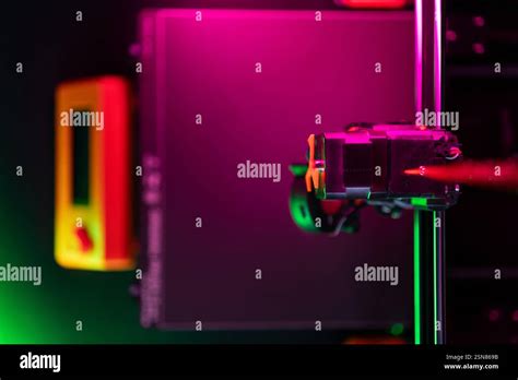 3d Printer Hot Table Surface From Above Dark Neon Light Orange Details Pink And Green Extruder