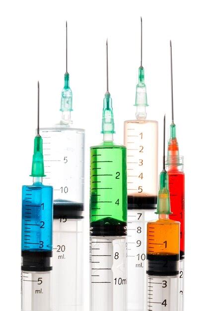 Premium Photo Close Up Of Syringes Over White Background