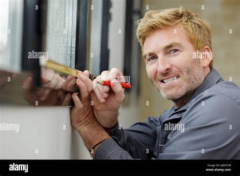 Happy Male Worker Measuring Window Stock Photo Alamy