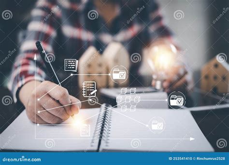 Man Using Pen Write Project And Folder Of Document Management System Online Documentation