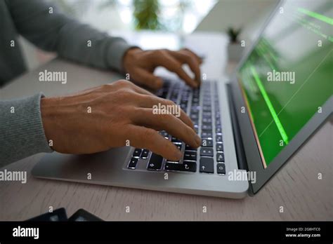 Hacker Using Computer At Table Stock Photo Alamy