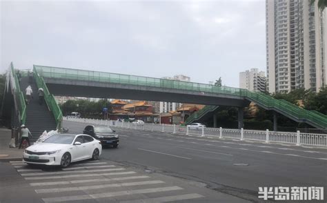 整修！过街天桥穿“网衣” 半岛网