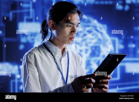 Computer Scientist Using Tablet To Maintenance Artificial Intelligence