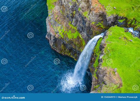 Aerial View Of Mulafossur Waterfall In Gasadalur Village In Faroe