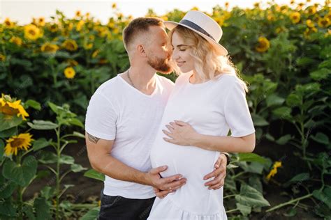 Free Photo Man And Pregnant Woman Hug Each Other Tender Standing In
