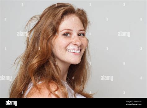 Woman Portrait Beautiful Female Model Lady With Freckles And Long Ginger Hairstyle Looking At