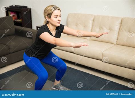 Pretty Girl Doing Some Squats At Home Stock Image Image Of Sofa Attractive 85863019