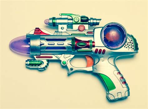 High Angle View Of Squirt Gun On Table Premium Photo