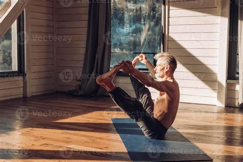 Senior Man With A Naked Torso Practicing Yoga Classic Asana Training In