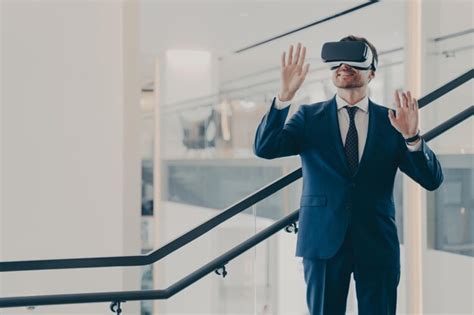 Premium Photo Impressed Office Worker In Vr Goggles Exploring Virtual World Gesturing And