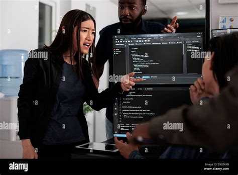 Diverse Software Developers Analyzing Html Code And Database Brainstorming Ideas To Develop New