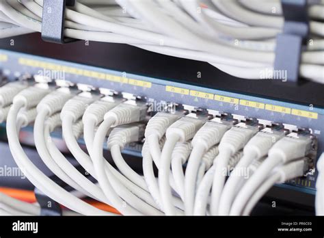 Gigabit Network Switch With Aligned Patch Cables In Datacenter Stock Photo Alamy
