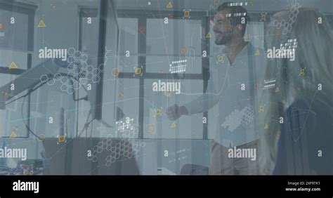 Image Of Statistical Data Processing Over Biracial Man High Fiving His Colleague At Office Stock