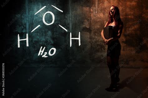 Sexy Girl Or Secretary Or Female Babe Presenting Handdrawn Chemical Formula Of H2O Water