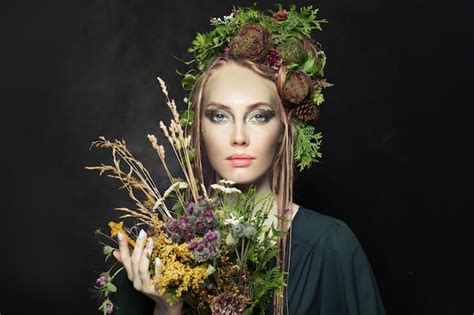 Premium Photo Nymph Woman With Wild Flowers On Black Background