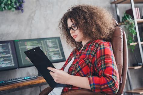 Young Female Programmer Working From Home In A Casual Workspace