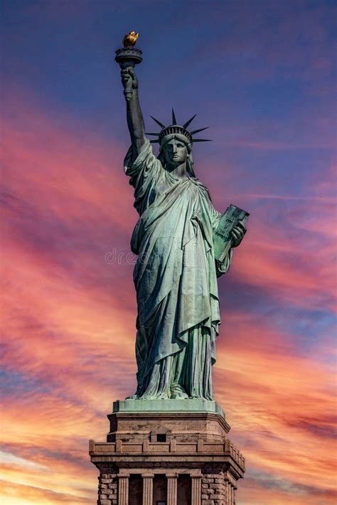 Vertical Photograph Of The Statue Of Liberty In The Big Apple Under A