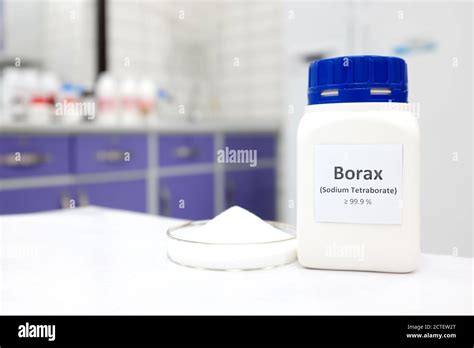 Selective Focus Of A Bottle Of Borax Chemical Compound Or Sodium Tetraborate Beside A Petri Dish