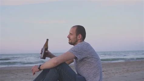 Drunk Man Drinking Beer On The Sea Beach Stock Video Pond5