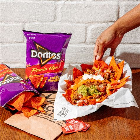 Taco Bell Launches New Doritos Flamin Hot Nachos Frugal Feeds