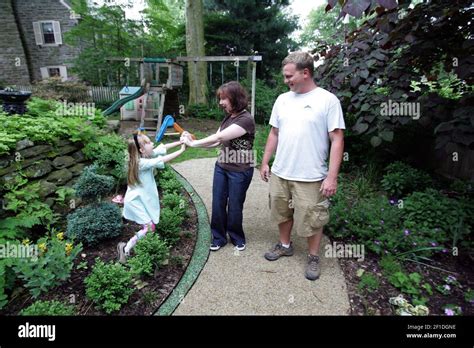 Natalie Bauder Plays In Her Alice In Wonderland Garden With Her Mother Laura Center And