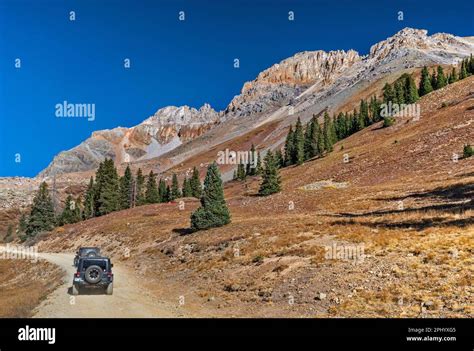 4x4 Vehicles At Ophir Pass Road Lookout Peak On Left Unnamed Peaks