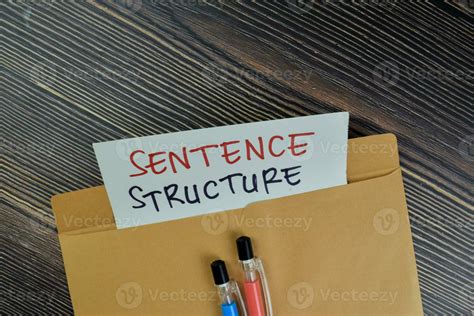 sentence structure text on document above brown envelope 23671315