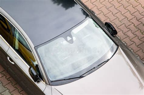 Windscreen With A Detail Of Rain Sensor For Automatic Wipers On Car